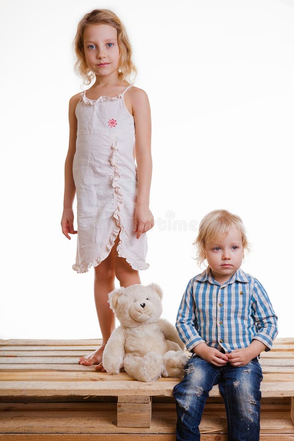 Little Brother and Sister Playing Together in a Room Stock Photo ...