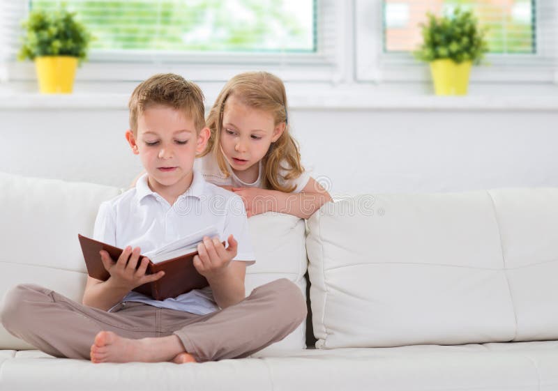 Blond Siblings Reading Book Stock Image - Image of book, spring: 22996401