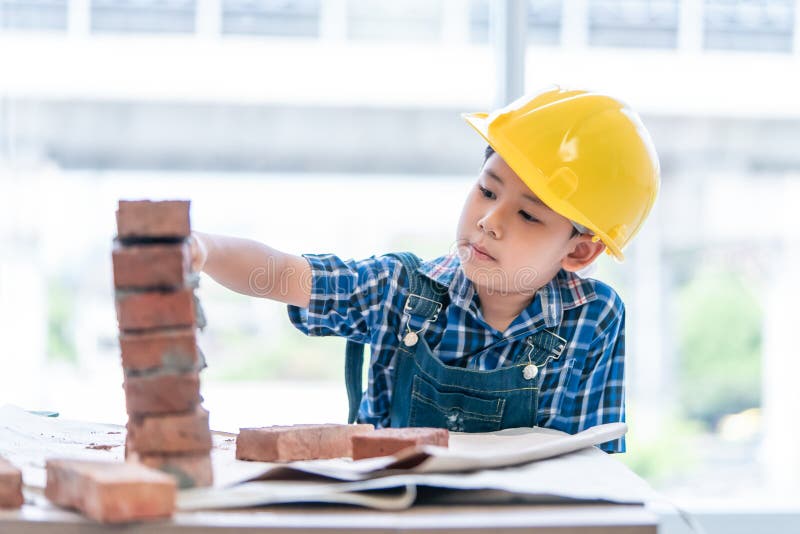 Builder Boy is Learning How To Build Brick Wall Stock Photo - Image of ...