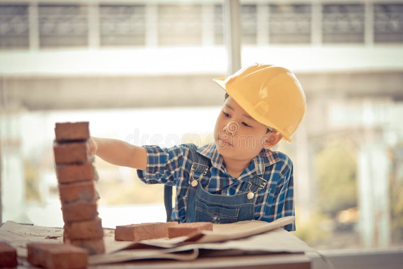 Builder Boy is Learning How To Build Brick Wall in Vintage Tone Stock ...