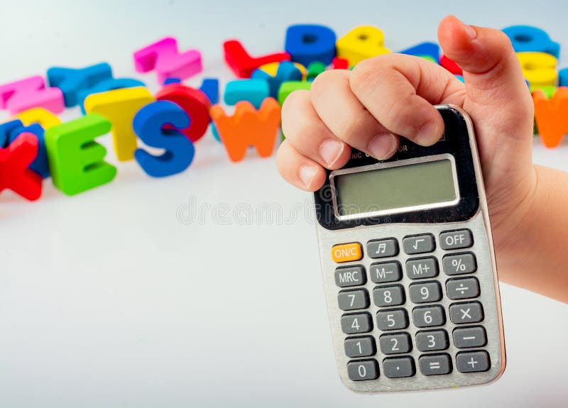 Little Calculator in Hand with Colorful Letters Behind Stock Image ...