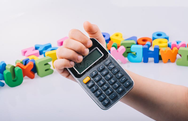 Little Calculator in Hand with Colorful Letters Behind Stock Image ...