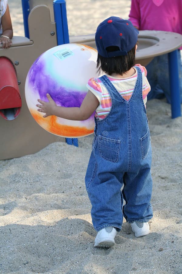 Little Carying Big Ball stock image. Image of carry, park - 1070989