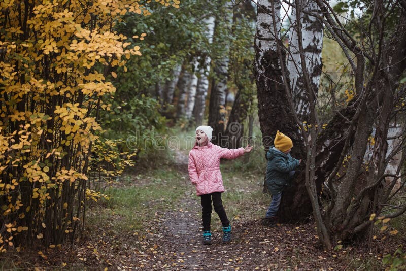 Little Caucasian Children in the Autumn Forest among Trees Stock Photo ...
