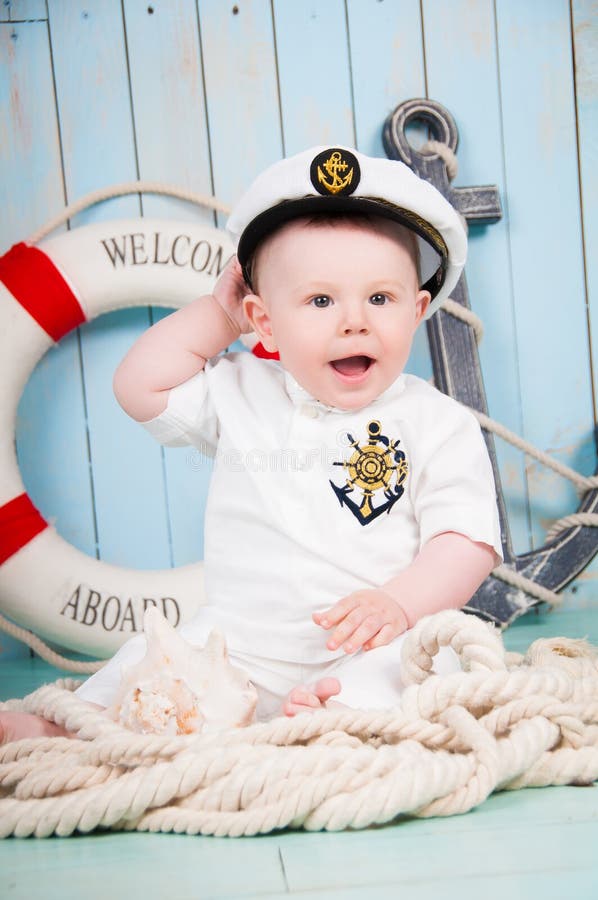 A Little Cheerful Boy Captain in the Maritime Interior Stock Photo ...