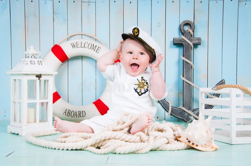 A Little Cheerful Boy Captain in the Maritime Interior Stock Photo ...