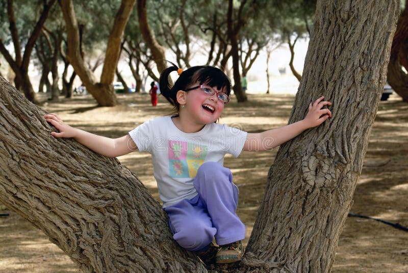 Girl Sitting in a Tree Fork Stock Photo - Image of young, beautiful ...