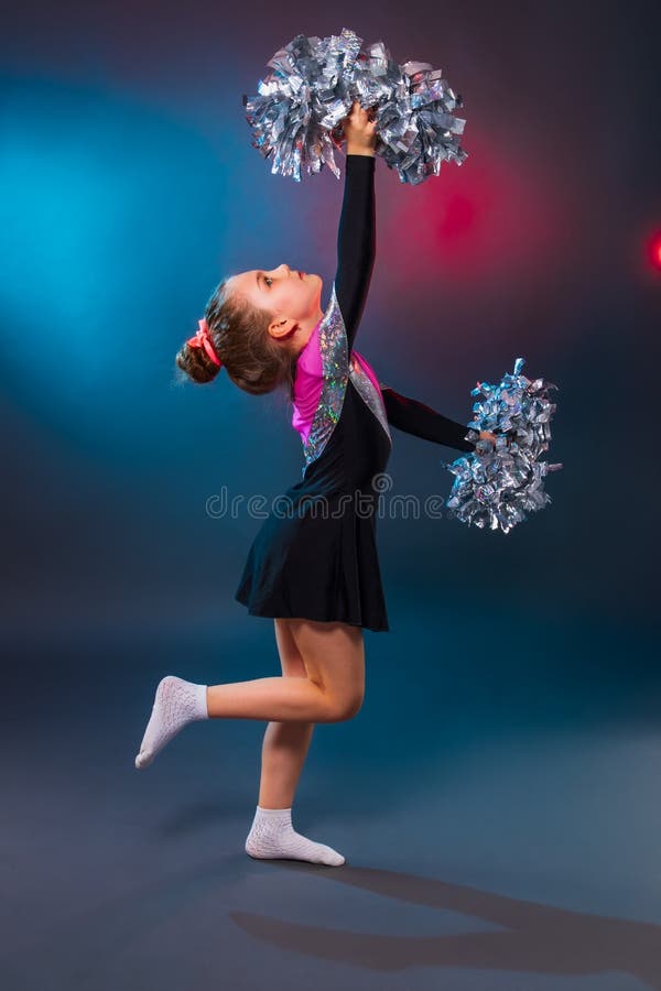 Little Cheerleader Practicing Dance Elements in Studio with Color Light ...