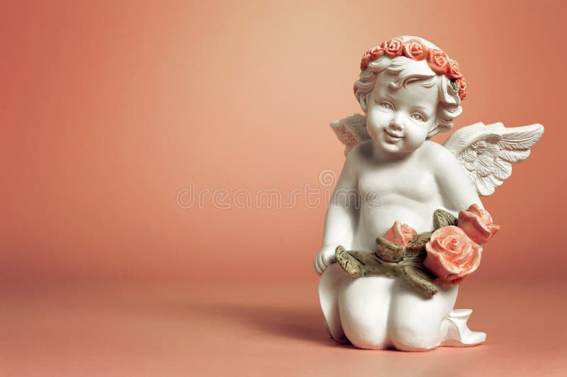 Cherub holding flowers stock photo. Image of faith, bunch - 152351396