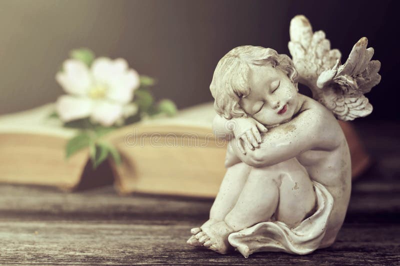 Sleeping Cherub Angel Statue with Wings for a Bed Stock Photo - Image ...