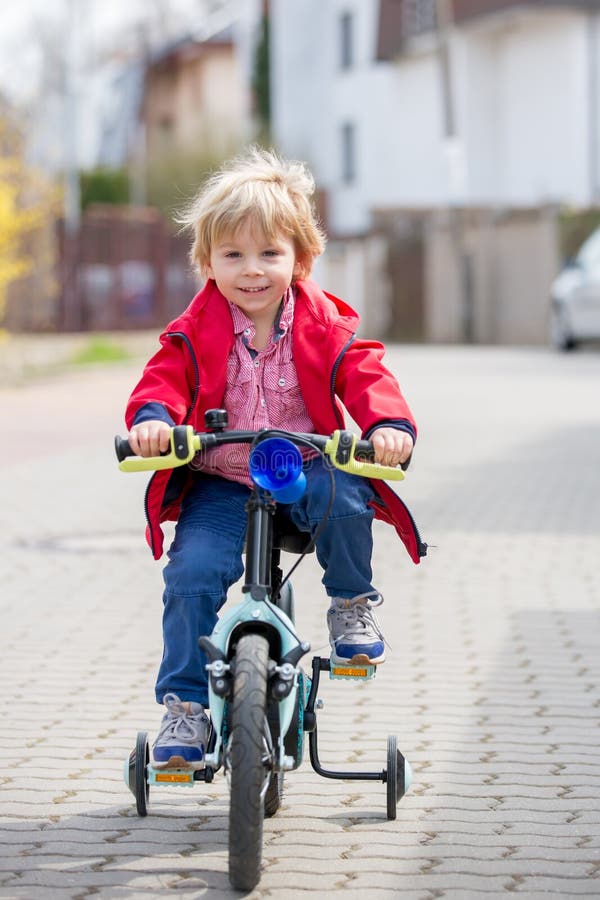 Little Child, Blond Boy, Learning How To Ride a Bicycle in the Park ...