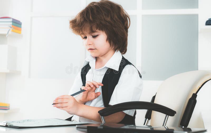 Little Child Boy Businessman or Manager Working in Office. Stock Image ...