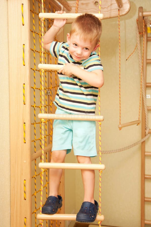 Little Child Climbing on Rope Ladder. Stock Photo - Image of funny ...