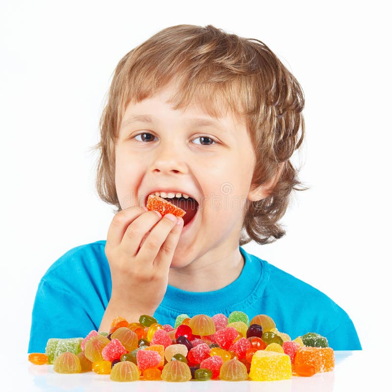 Little Boy Eating Colored Jelly Candies on White Background Stock Image ...