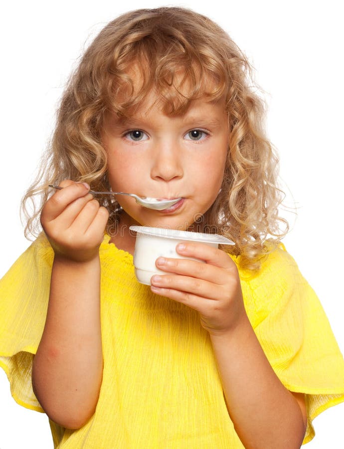 Little child eating yogurt stock image. Image of breakfast - 31600737
