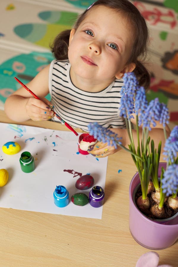 Little Child Girl Paint Easter Eggs at Home Stock Photo - Image of ...
