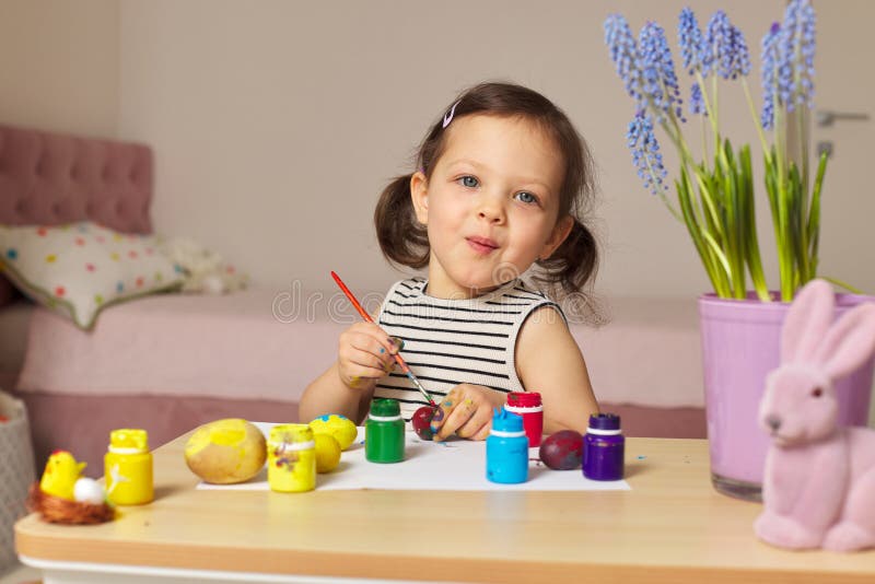 Little Child Girl Paint Easter Eggs at Home Stock Image - Image of ...