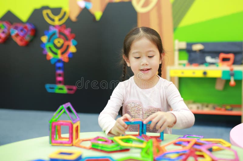 Little Child Girl Playing Magnets Toy for Brain Development Stock Photo ...