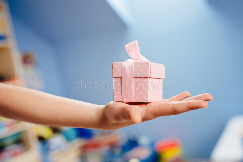 Little Child Giving Present. Stock Image - Image of human, gift: 82102215