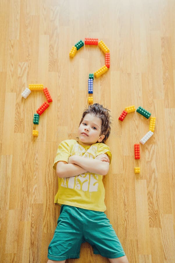 Little Child is Laying with Colorful Plastic Blocks Stock Photo - Image ...