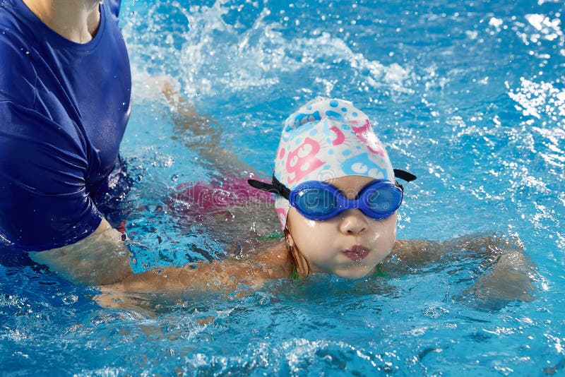 Little Child Learning To Swim in Pool with Teacher Stock Photo - Image ...