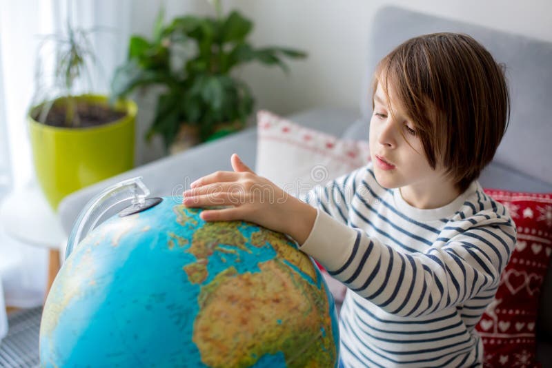 Little Child, Looking at Illuminated Globe, Exploring Stock Image ...