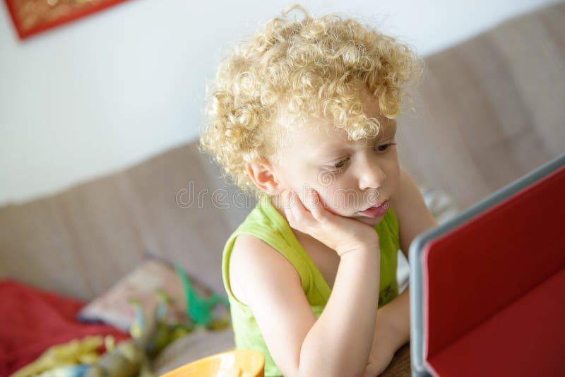 A Little Child Looking at a Tablet Stock Image - Image of learning ...