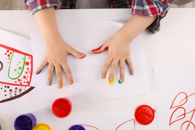 Little Child Making Hand Prints on Paper with Painted Palms at White ...