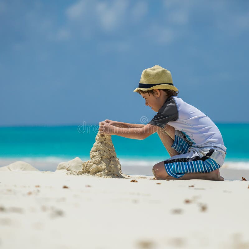 Little Child Making Sand Castles at the Beach Stock Photo - Image of ...
