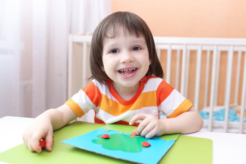 Little Child Modelling Apple Tree of Playdough Stock Image - Image of ...