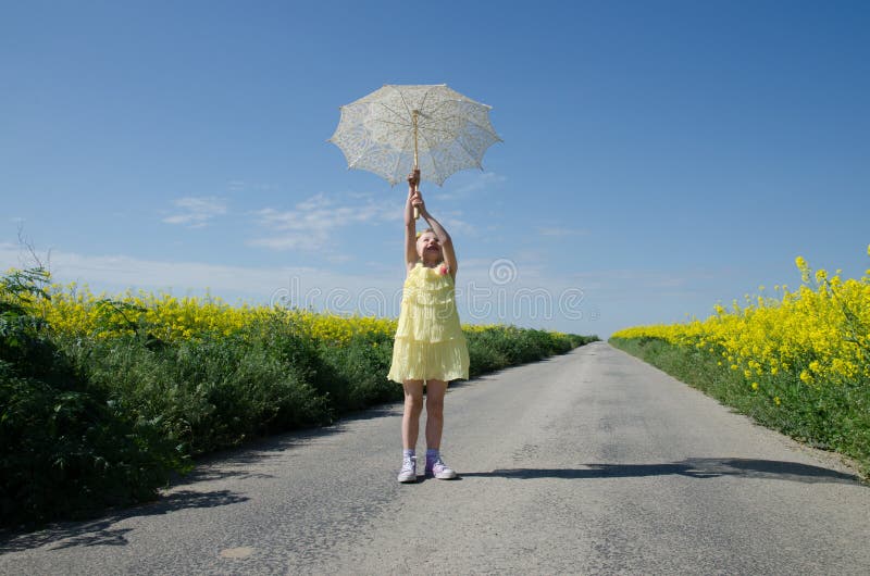 Little child with parasol stock image. Image of alone - 143930455