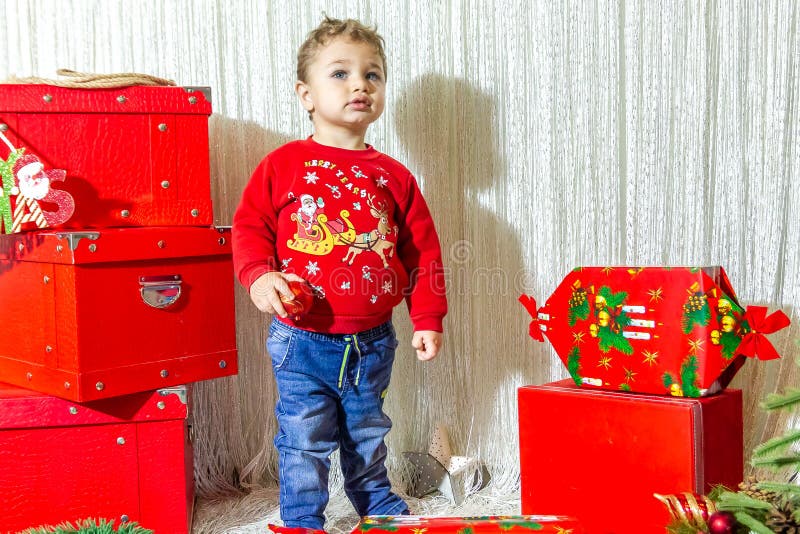 Little Child Playing with Christmas Decorations in Studio, Little Child ...