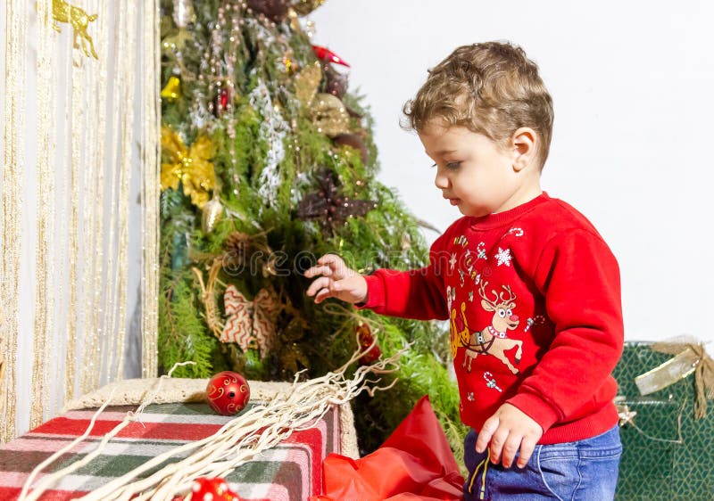 Little Child Playing with Christmas Decorations in Studio, Little Child ...