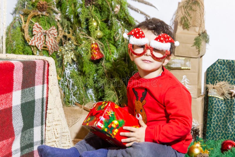Little Child Playing with Christmas Decorations in Studio, Little Child ...
