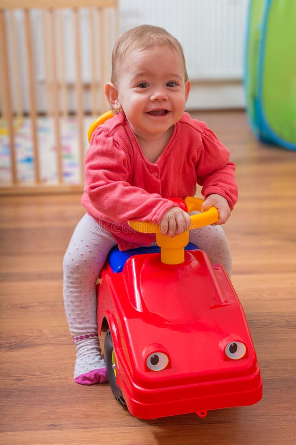 Little Child is Playing and Driving Toy Red Car Stock Image - Image of ...
