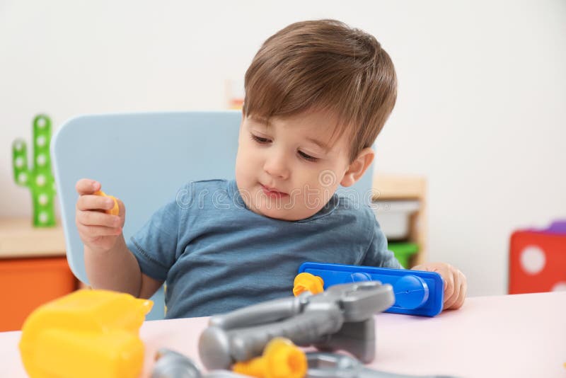Little Child Playing with Toy Construction Tools Stock Image - Image of ...