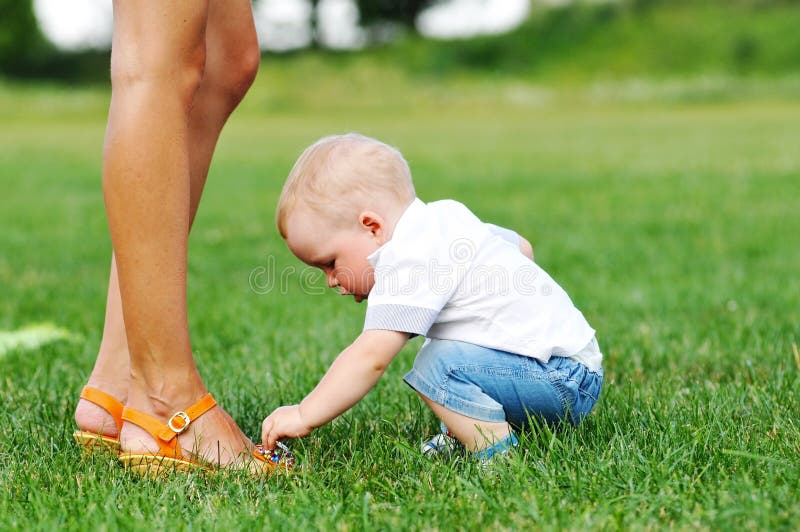 Little Child Touch Mom S Shoes Stock Image - Image of shirt, caucasian ...
