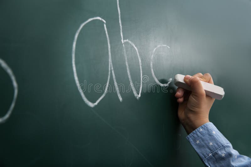 Little Child Writing Letters on Chalkboard Stock Image - Image of ...