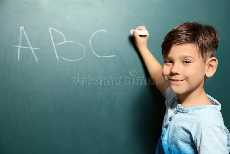 Little Child Writing Letters on Green Blackboard Stock Image - Image of ...