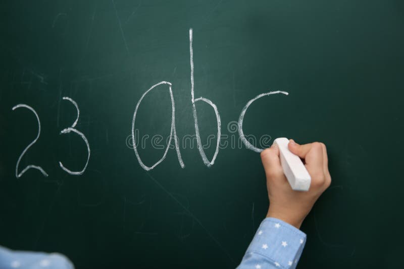 Little Child Writing Letters and Numbers on Chalkboard Stock Image ...