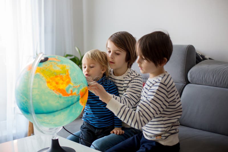 Little Children, Brothers, Looking at Illuminated Globe, Exploring ...