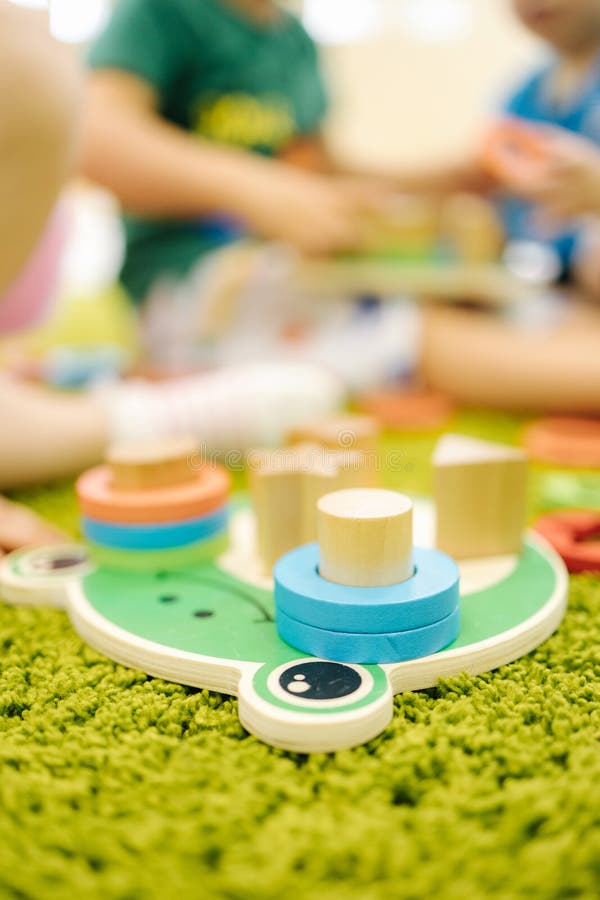 Little Children Play with Wooden Toys in Kindergarden Stock Photo ...