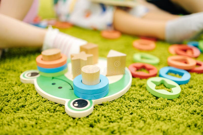 Little Children Play with Wooden Toys in Kindergarden Stock Image ...