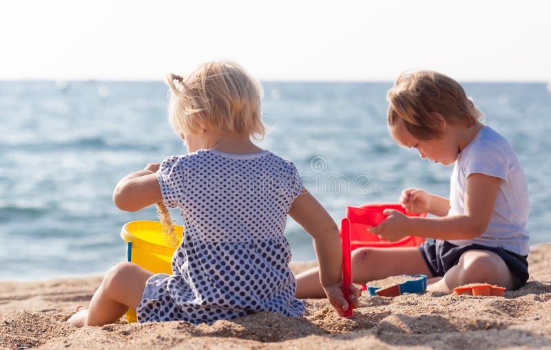 Little Children Playing with Sand Stock Photo - Image of childhood ...