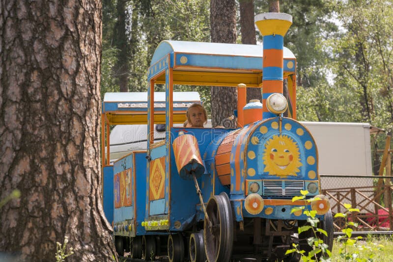 Little Children are Riding on a Children& X27;s Train in the Park Stock ...