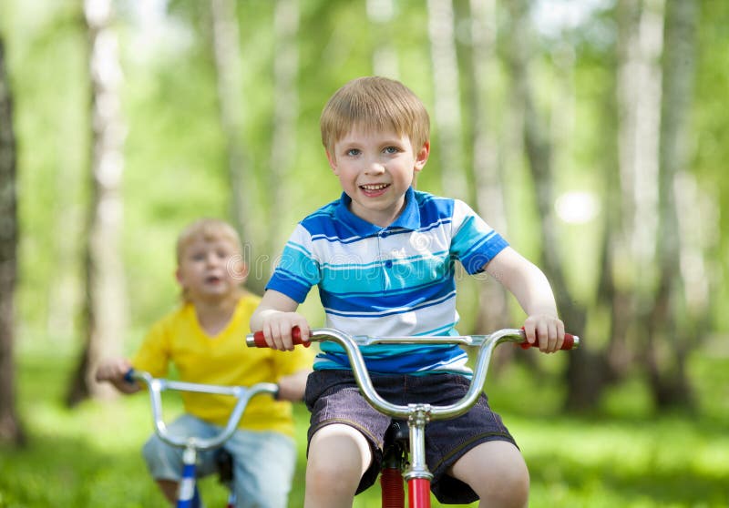 Little Children Riding Their Bikes Stock Image - Image of nature ...