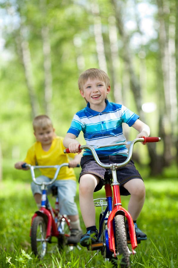 Little Children Riding Their Bikes Stock Photo - Image of caucasian ...