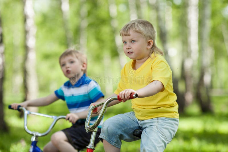 Little Children Riding Their Bikes Outdoors Stock Photo - Image of ...