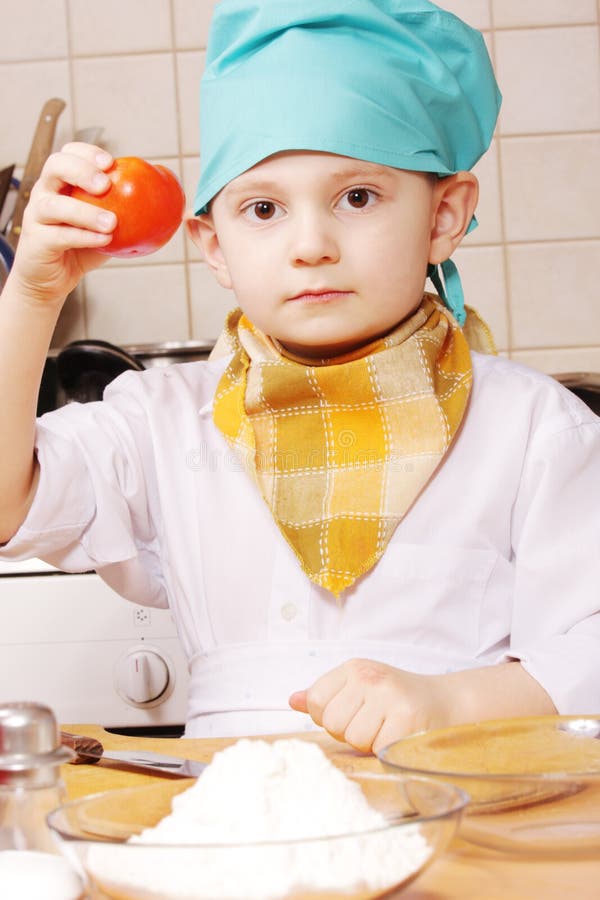 Little cook with tomato stock image. Image of child, vegetable - 12151553