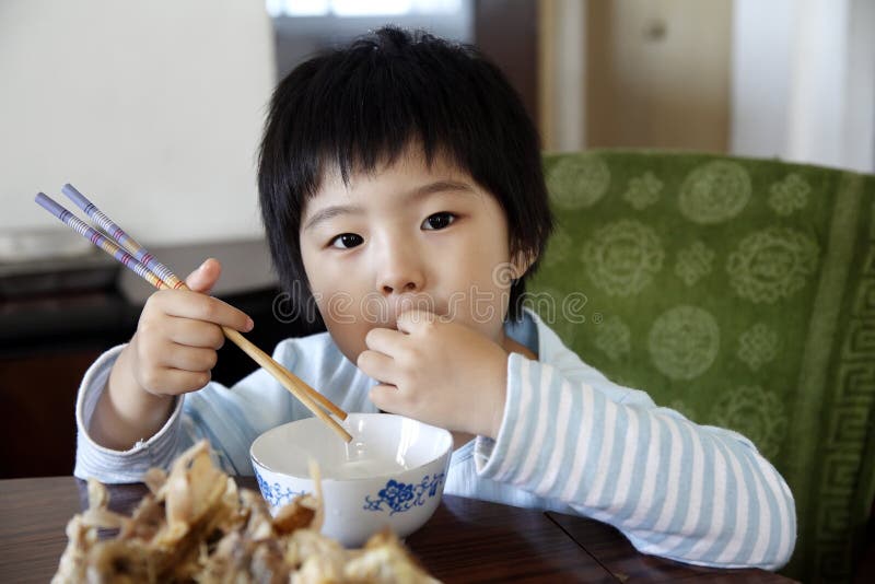 Little Cute Asian Girl Eating Stock Image - Image of chopsticks, kids ...